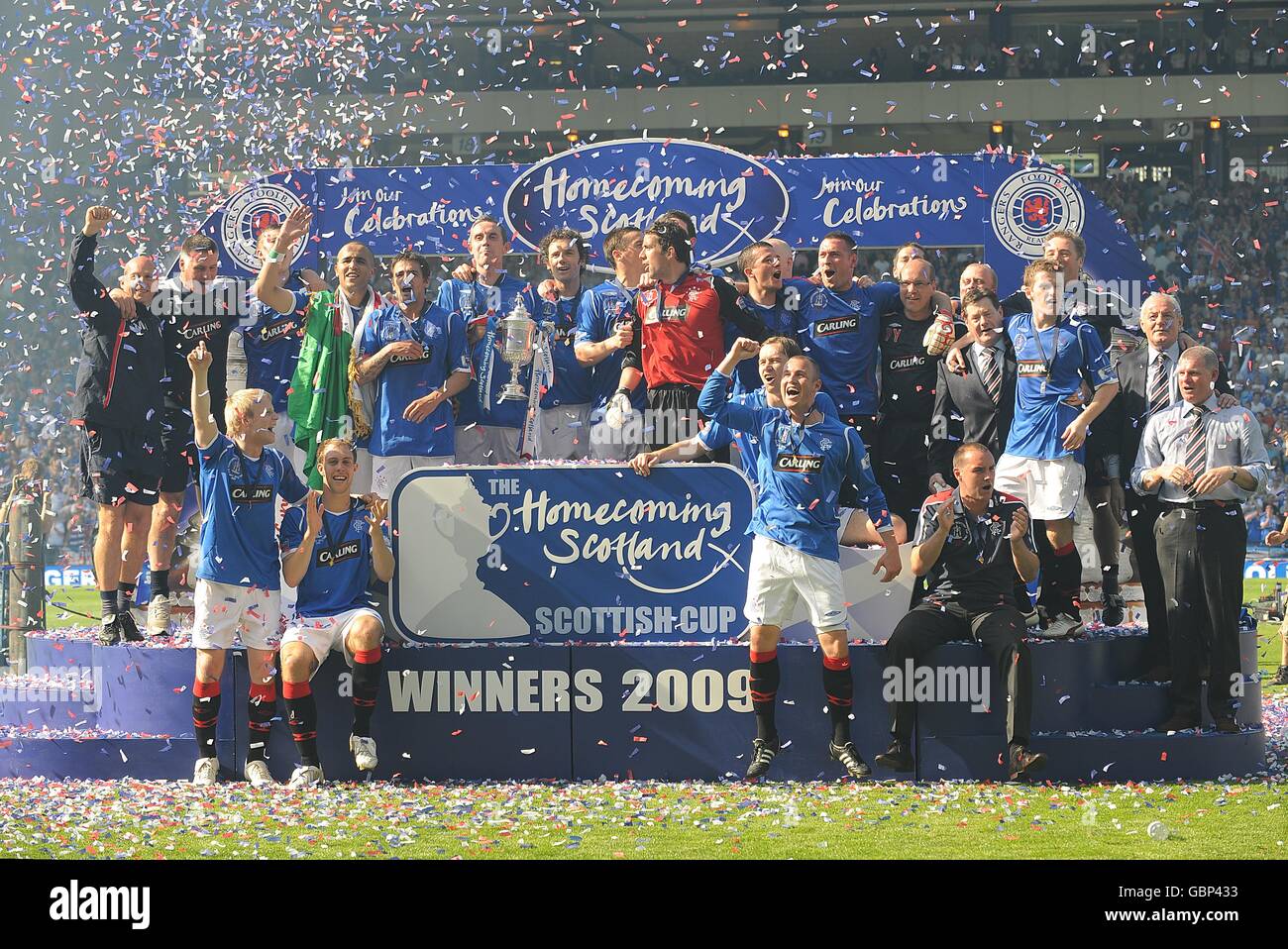 The Rangers team celebrate their victory on the podium as they lift the ...