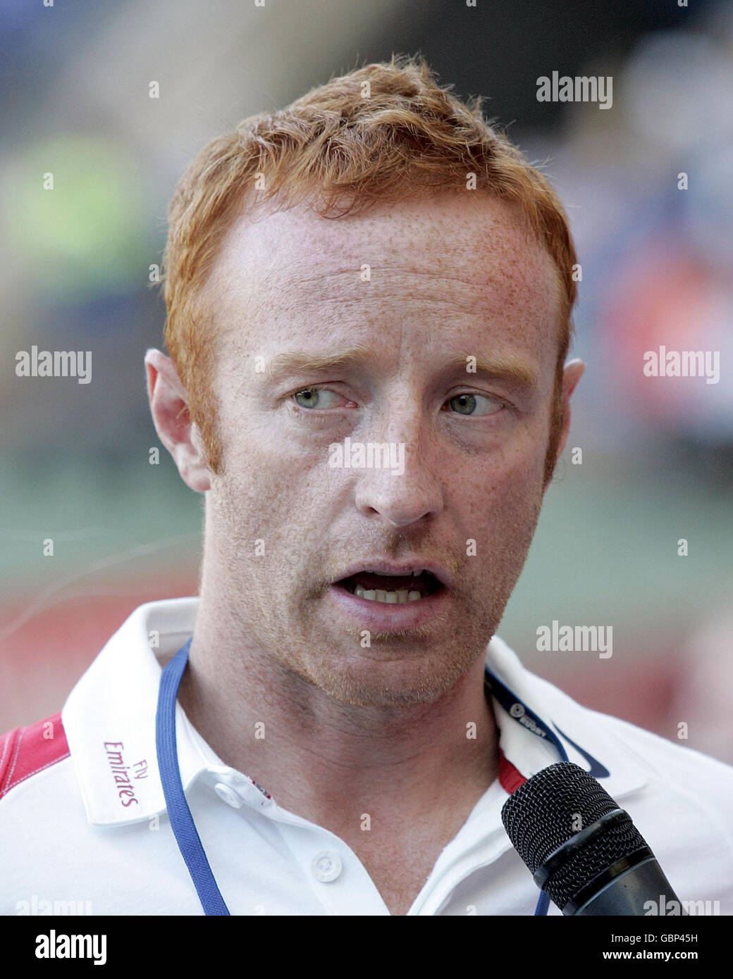 Rugby head shot headshot portrait speaking speaks into mic microphone ...