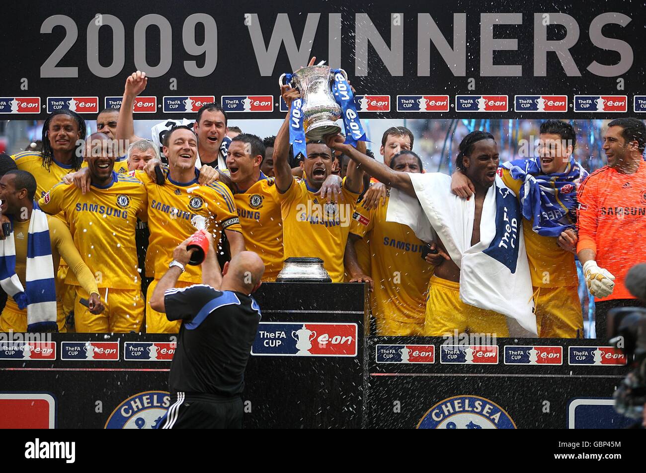 Chelsea's Jose Bosingwa (centre) holds the trophy as Chelsea celebrate ...