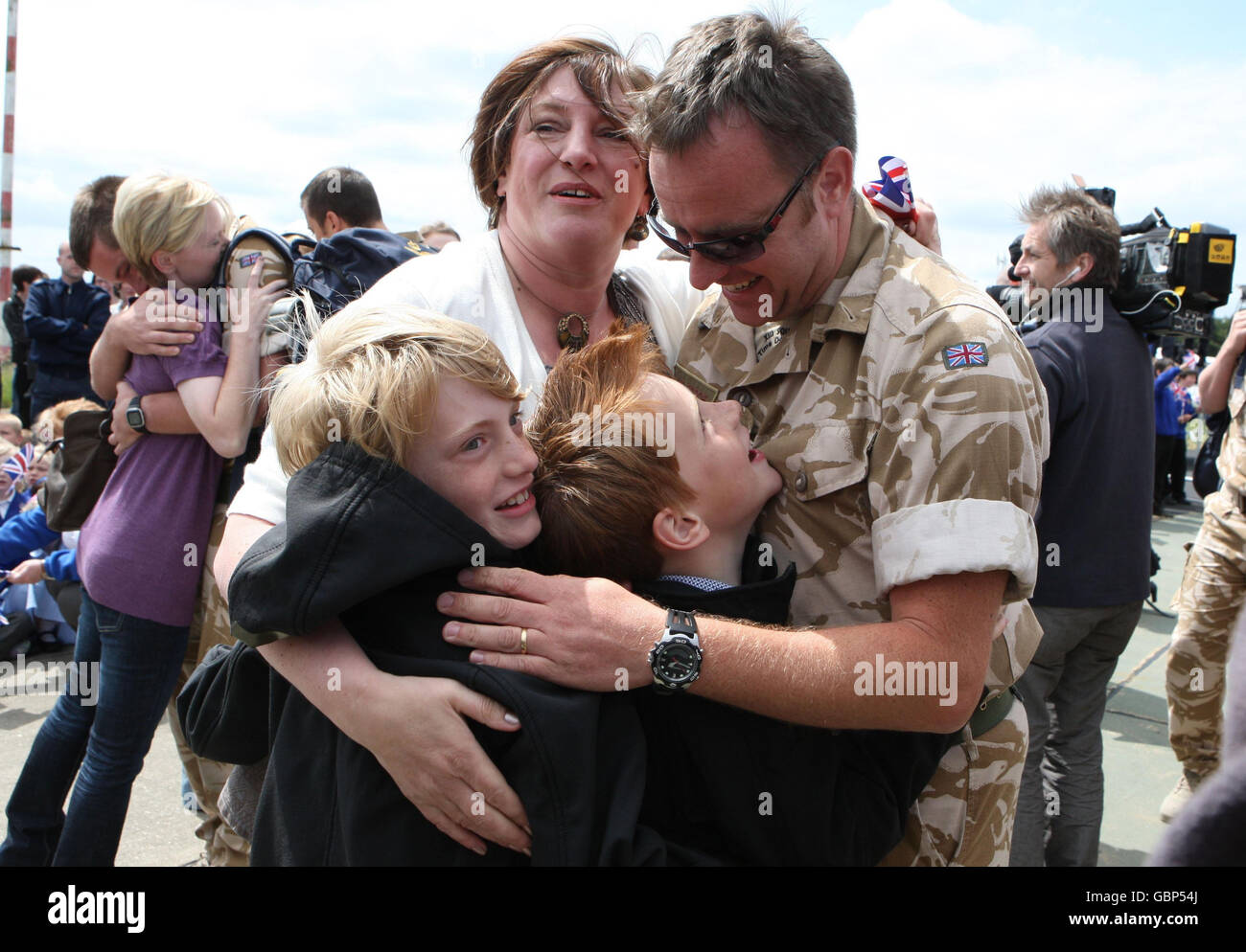 Nigel Fromage is greeted by his wife Michelle and children Jacob and ...