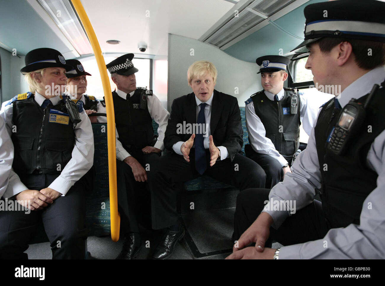 London Mayor Boris Johnson sits on a London bus in Brixton and chats ...