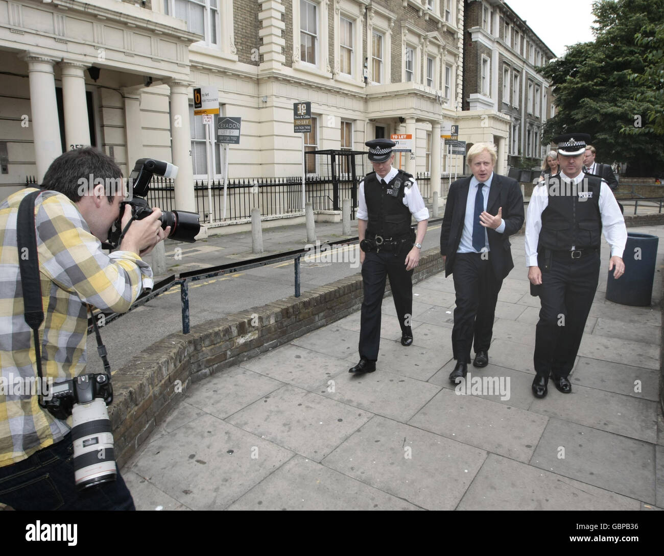 London Mayor Boris Johnson as he visits Brixton with Inspector Simon ...