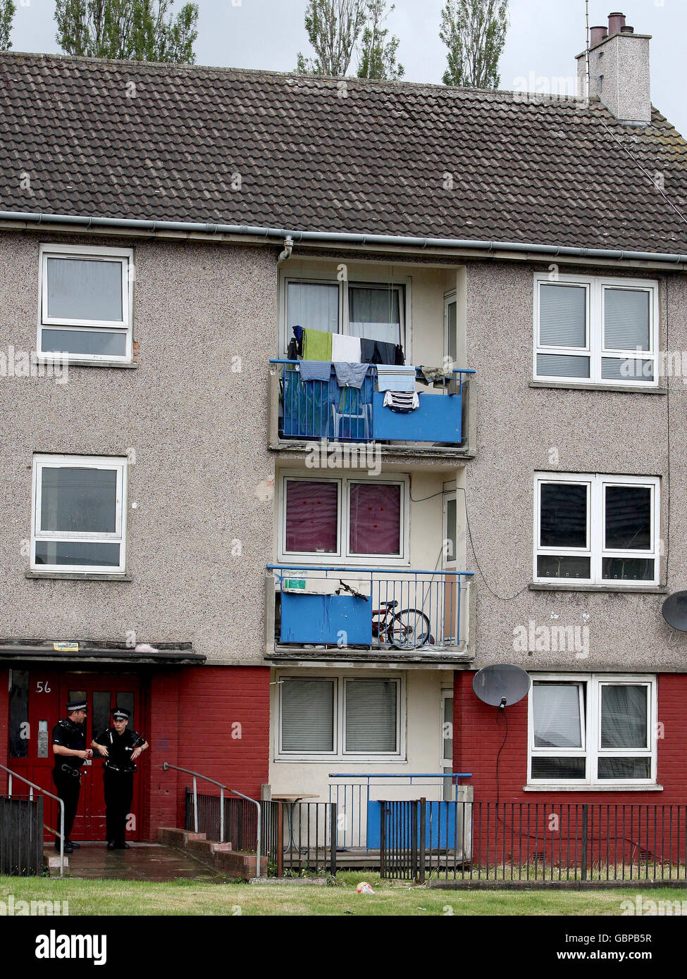 Police stand outside a block of flats in Glasgow, after Jacqui Fleming ...
