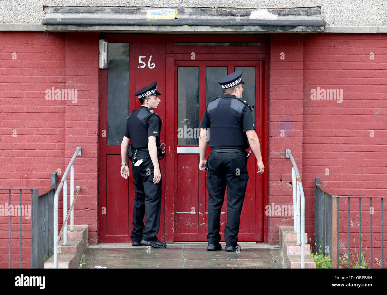 Police stand outside a block of flats in Glasgow, after Jacqui Fleming ...