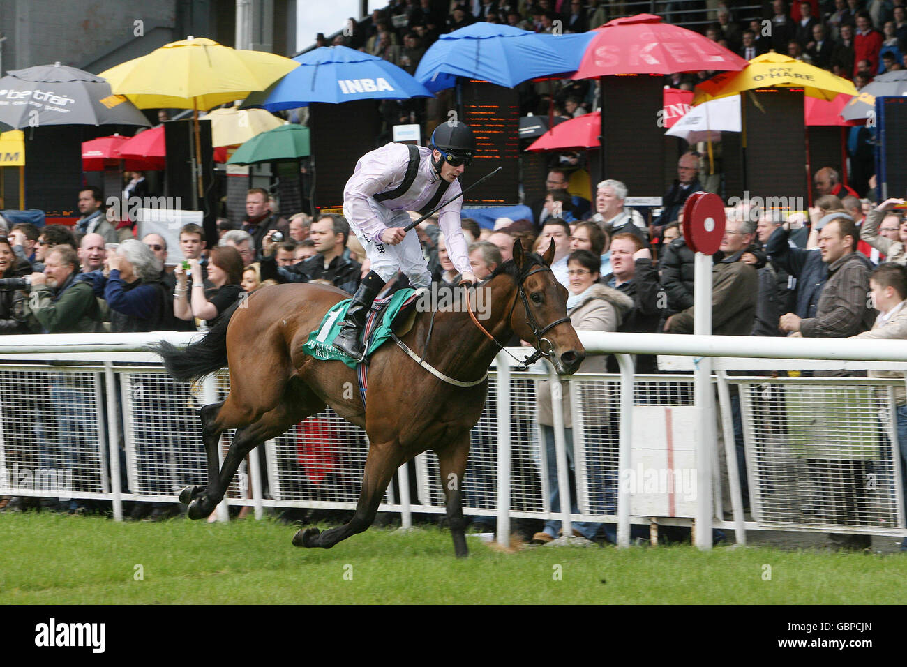 Richard Fahey crosses the line on Utmost Respect to win the Weatherbys ...