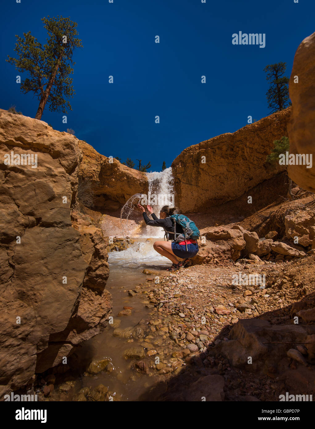 Backpacker Girl Exploring Bryce Canyon Waterfall near Mossy Cave USA ...