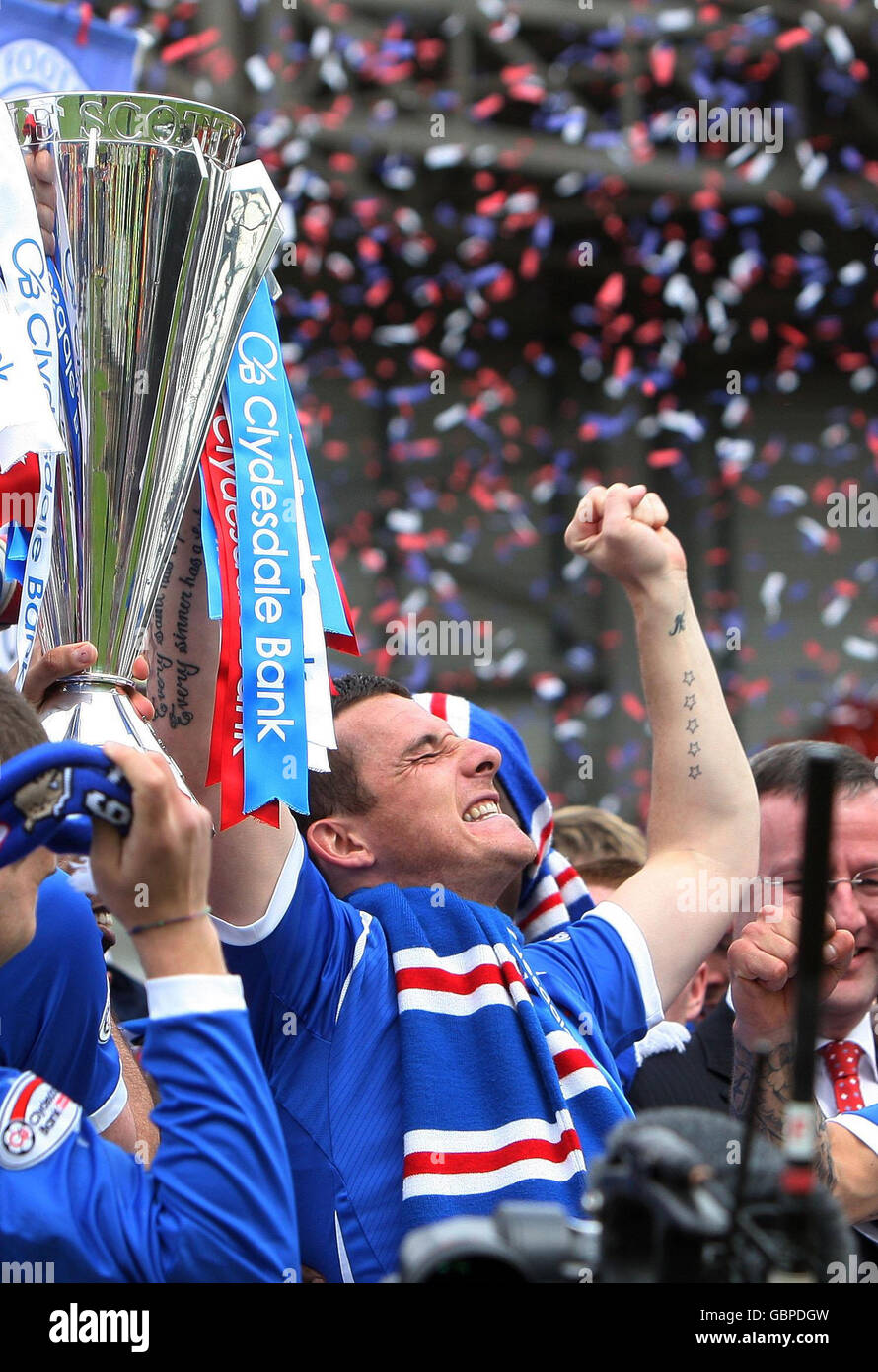 Rangers' Barry Ferguson (centre) celebrates along with his teammates as ...