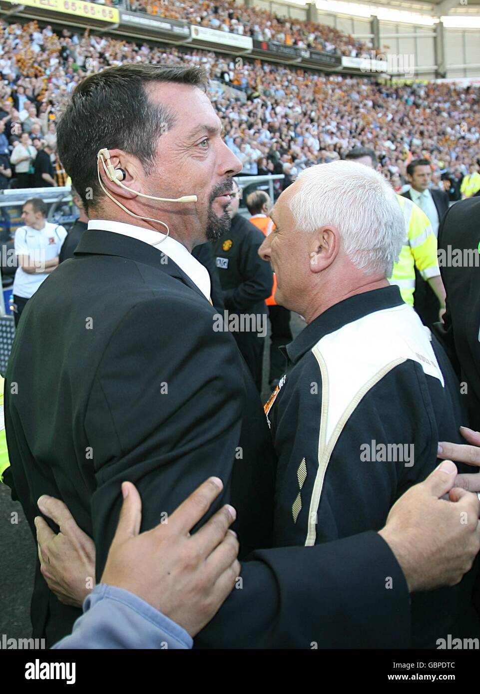 Hull City manager Phil Brown (left) celebrates with his backroom staff ...