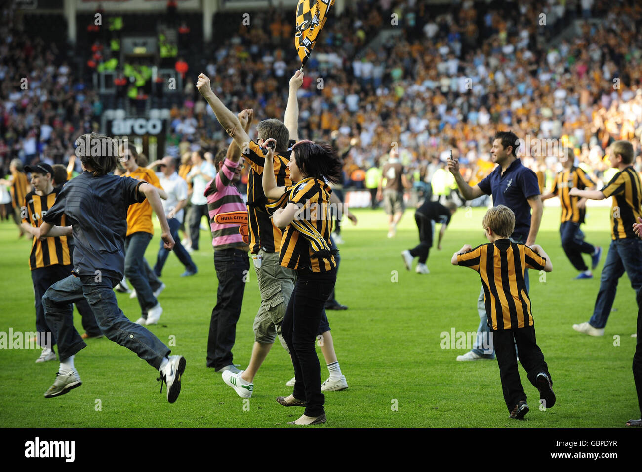 Hull City fans invade the pitch following the news that Hull had ...