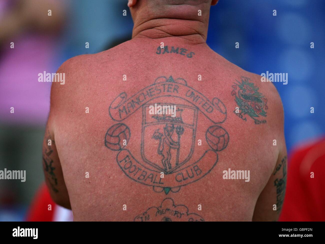 A Manchester United with tattoos showing his support, in the stands at ...