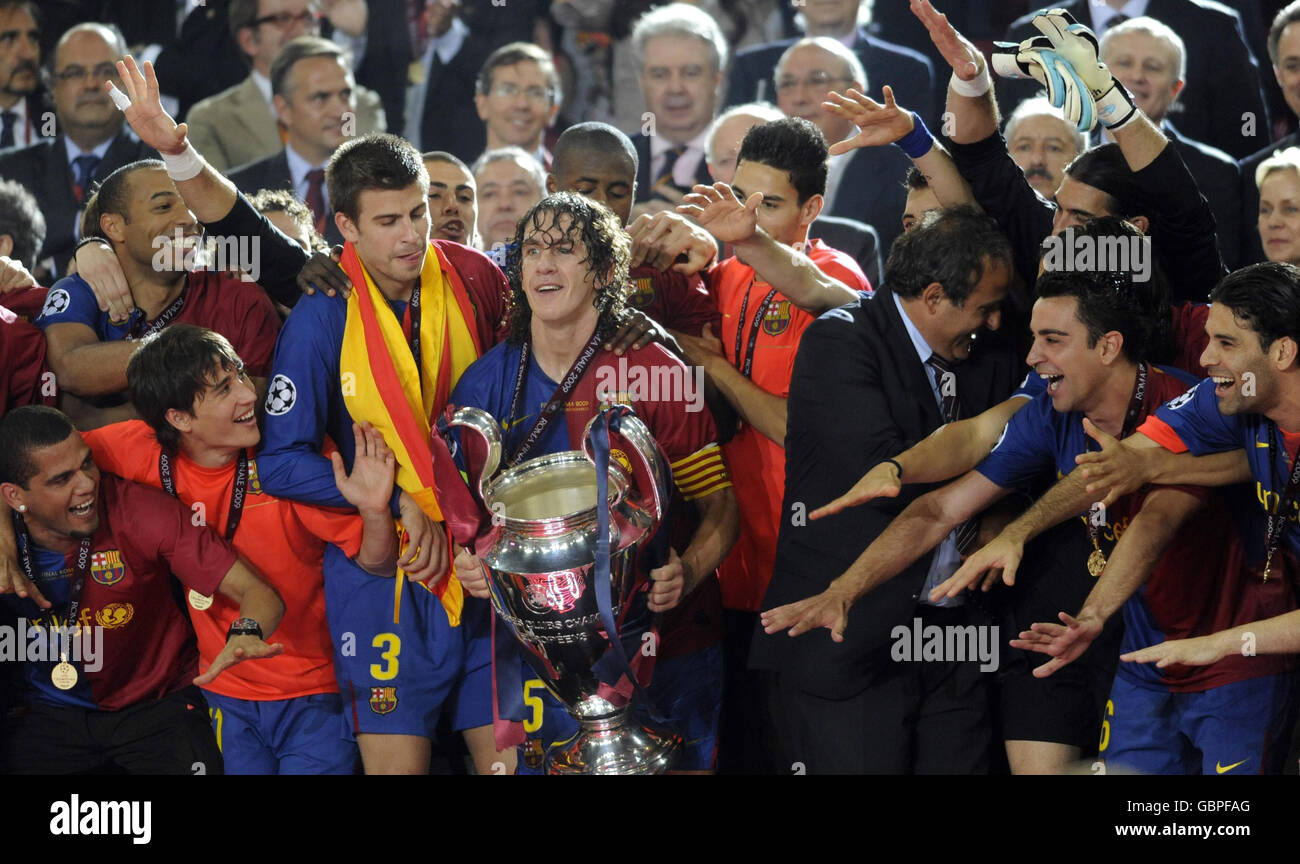 The barcelona team celebrate with the uefa champions league trophy hi ...