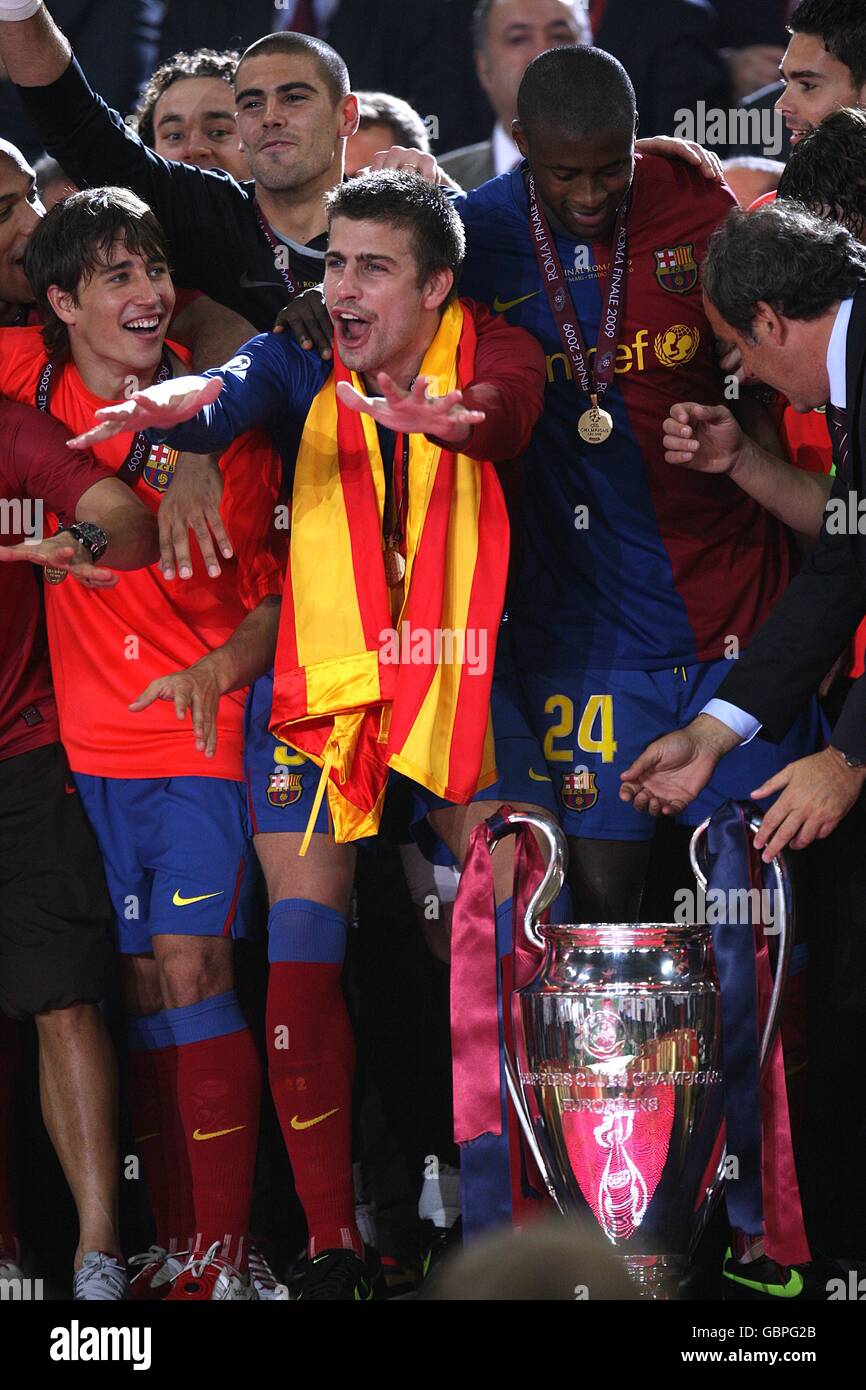 Barcelonas pique centre celebrates with the uefa champions league ...