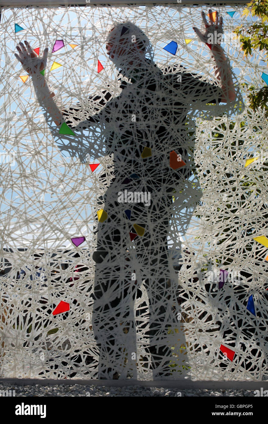 Garden designer John Frater puts the finishing touch to his show garden ...