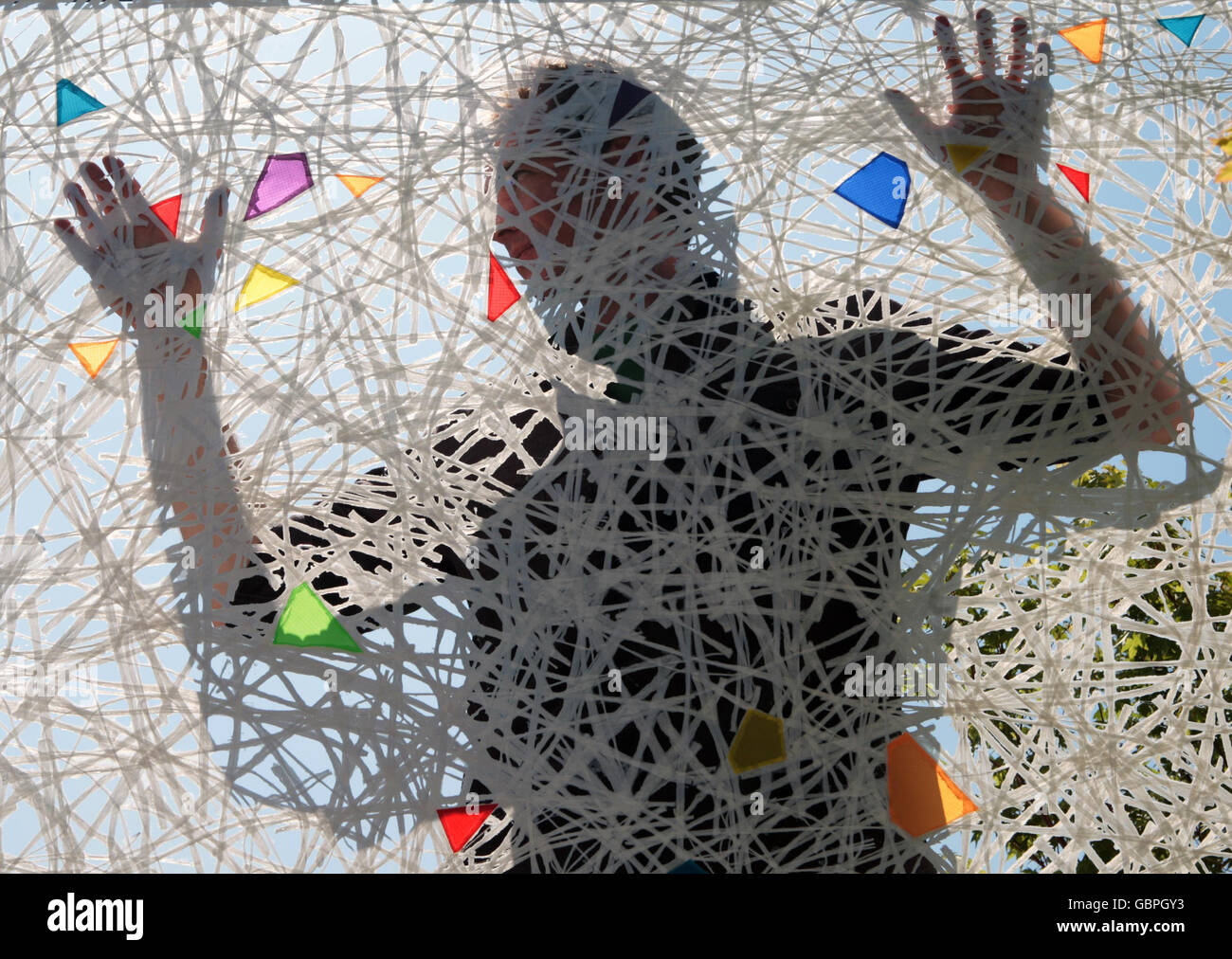 Garden designer John Frater puts the finishing touch to his show garden ...