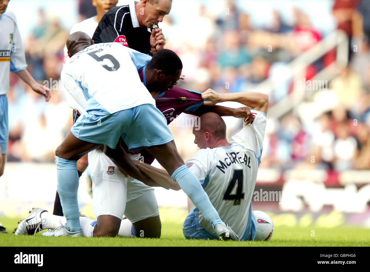 West Ham United's Marlon Harewood and Burnley's John McGreal fight on ...