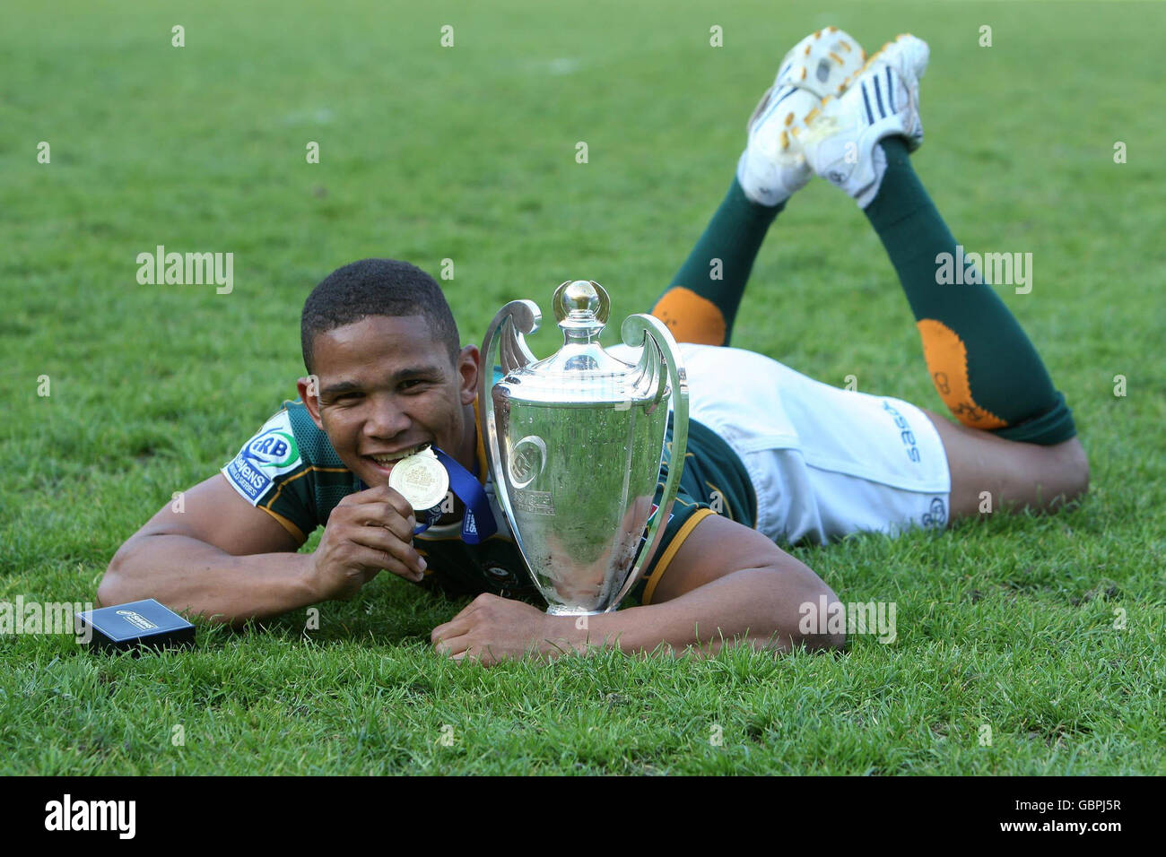 South Africa's Ryno Benjamin poses with the trophy during day two of ...