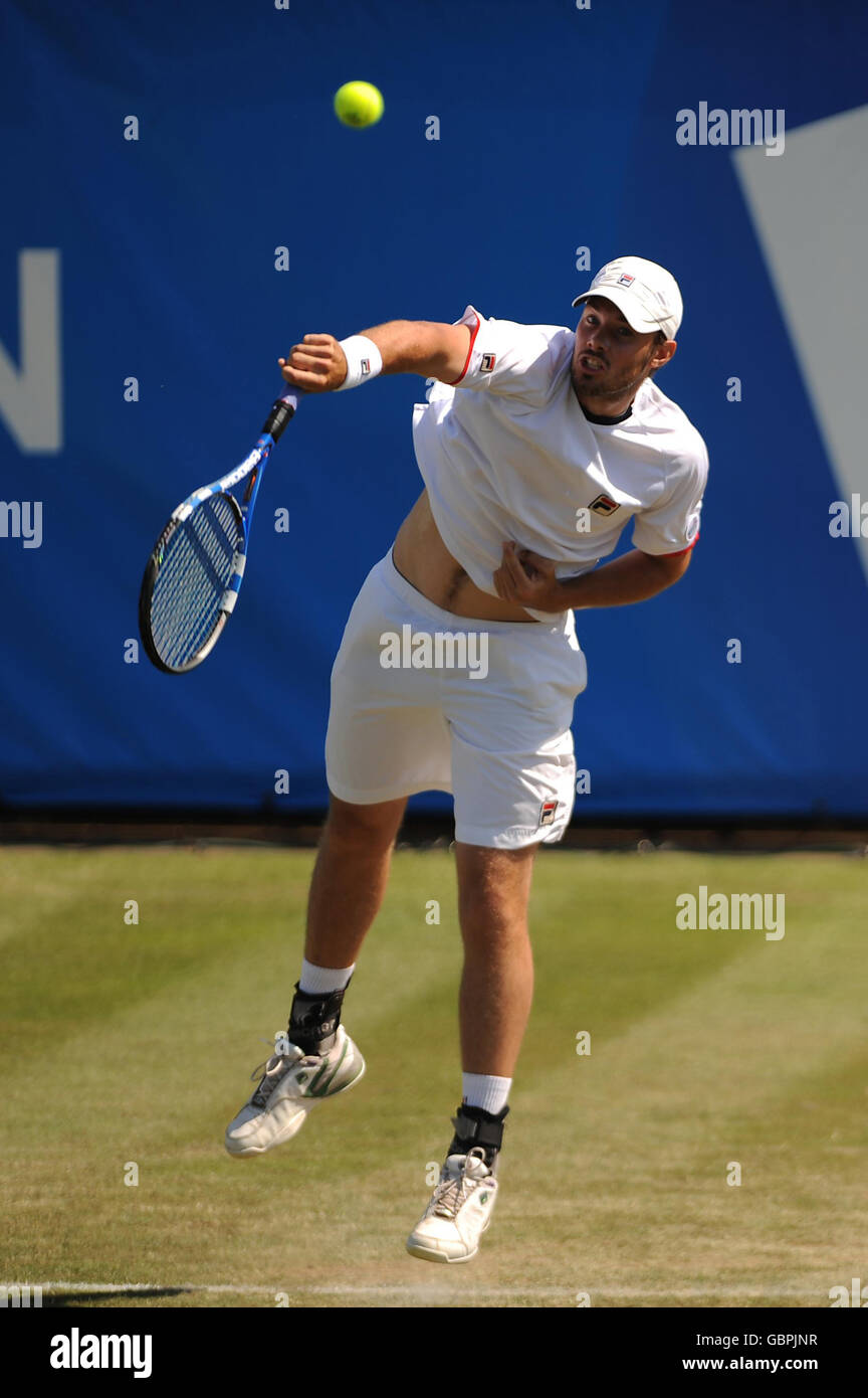 Great Britain's Chris Eaton (top) serves to South Africa's Kevin ...