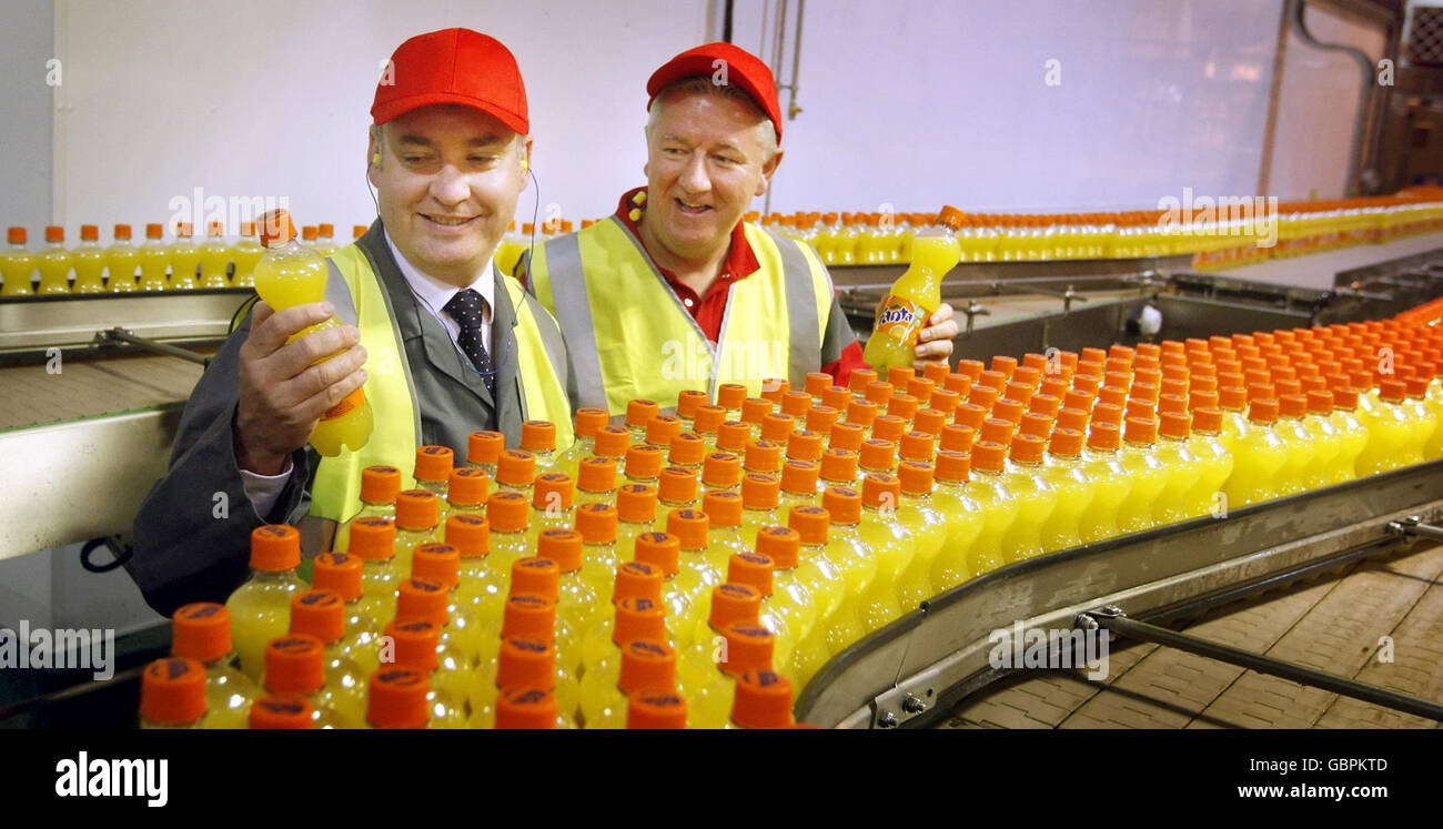 Environment Secretary Richard Lochhead (left) talks to Coca-Cola ...