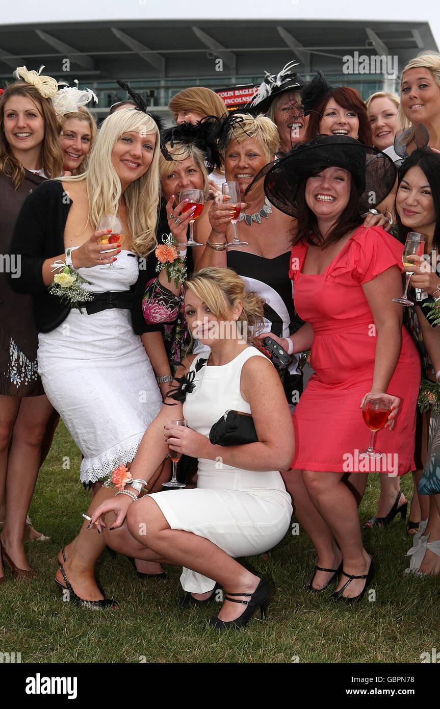 Racegoers during Ladies Day at Epsom Downs Racecourse Stock Photo - Alamy