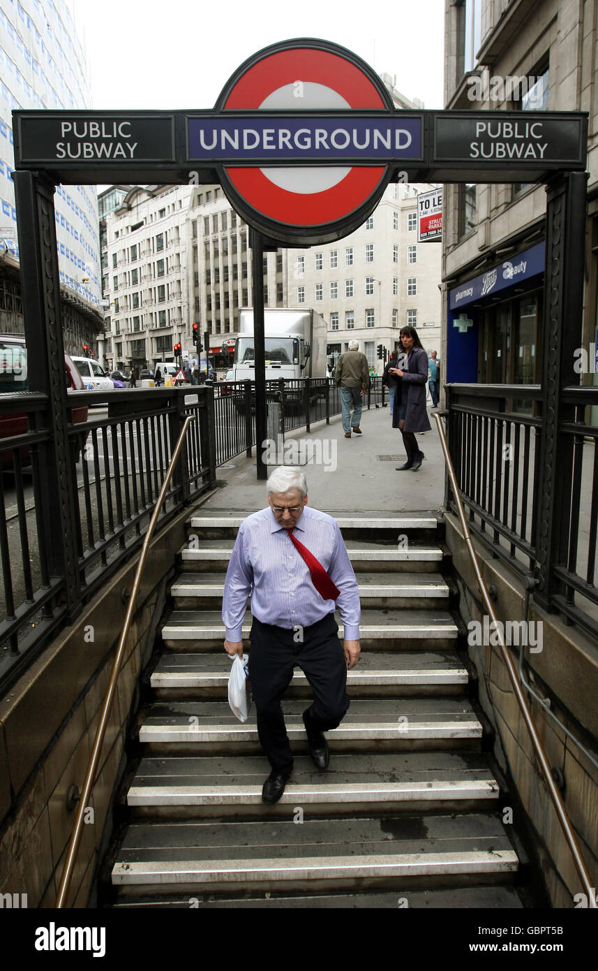 A man enters a subway at Monument Underground station, in central ...