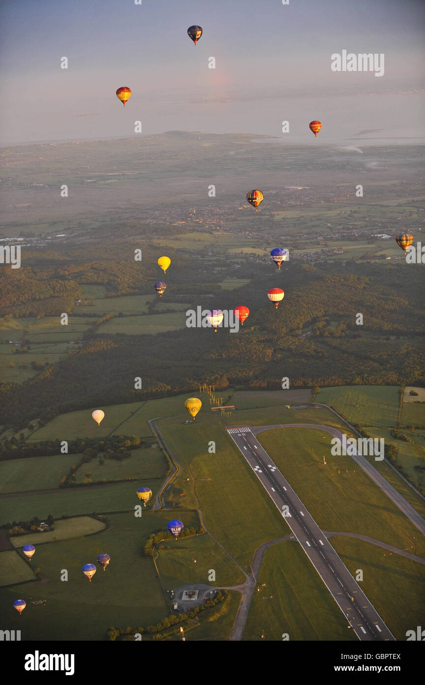 Hot air balloons lift off from the main runway at Bristol International ...