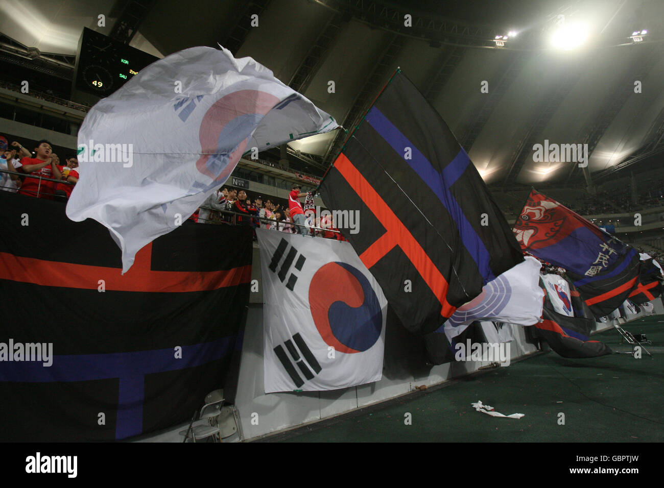 South korea fans wave flags in the stands hi-res stock photography and ...