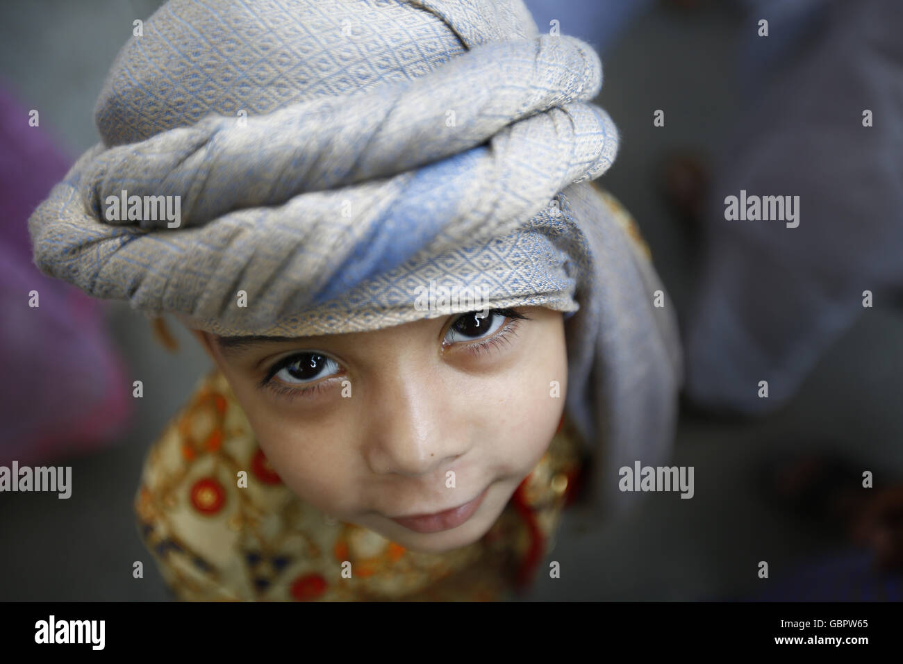 Kathmandu, Nepal. 7th July, 2016. A Nepalese Muslim boy looks on after ...
