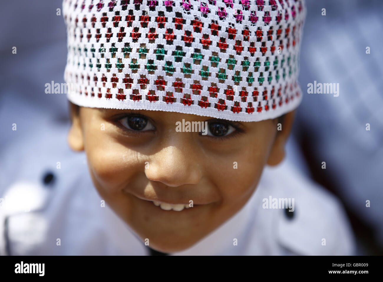 Kathmandu, Nepal. 7th July, 2016. A Nepalese Muslim boy smiles as he ...