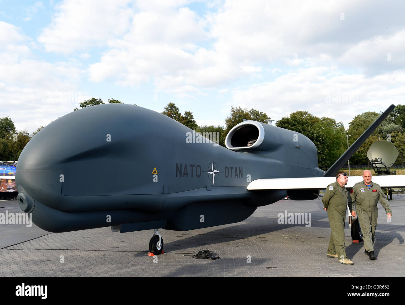 A Nato drone is set up in fron t of the national stadium in Warsaw ...