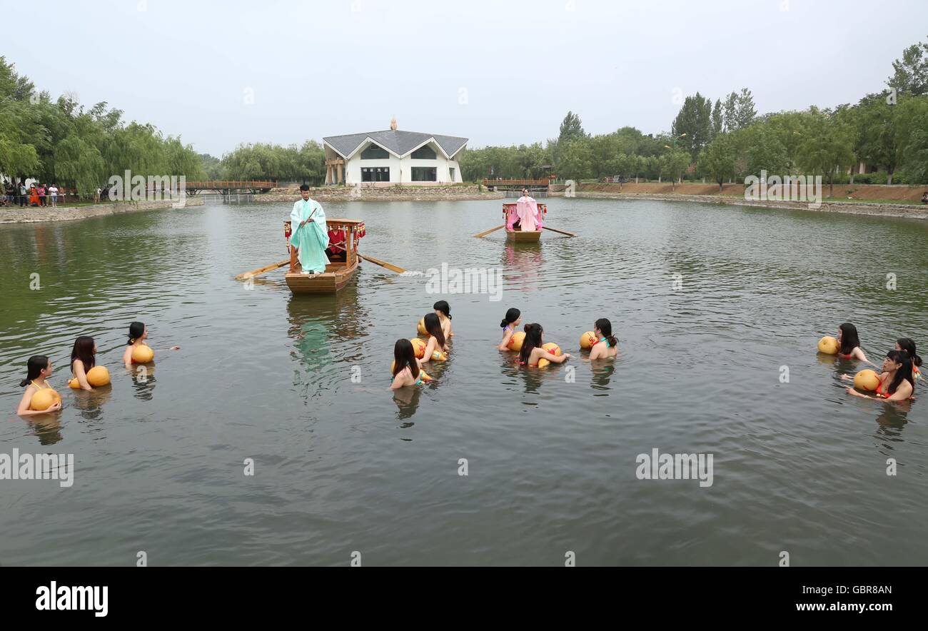 Huludao, China's Liaoning Province. 8th July, 2016. People take part in ...