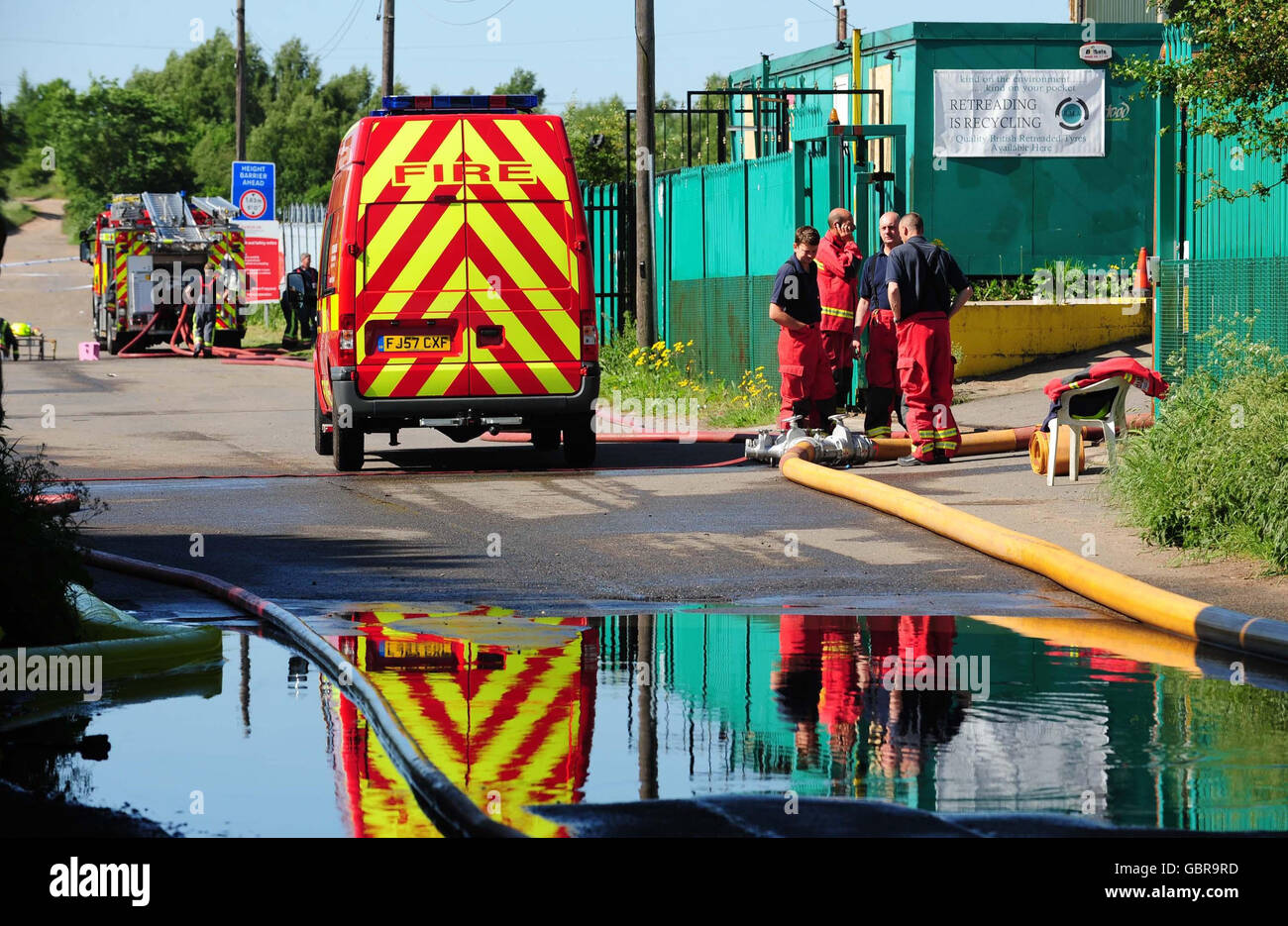 Firefighters at the scene of a fire at the Warsop Rubber Company ...