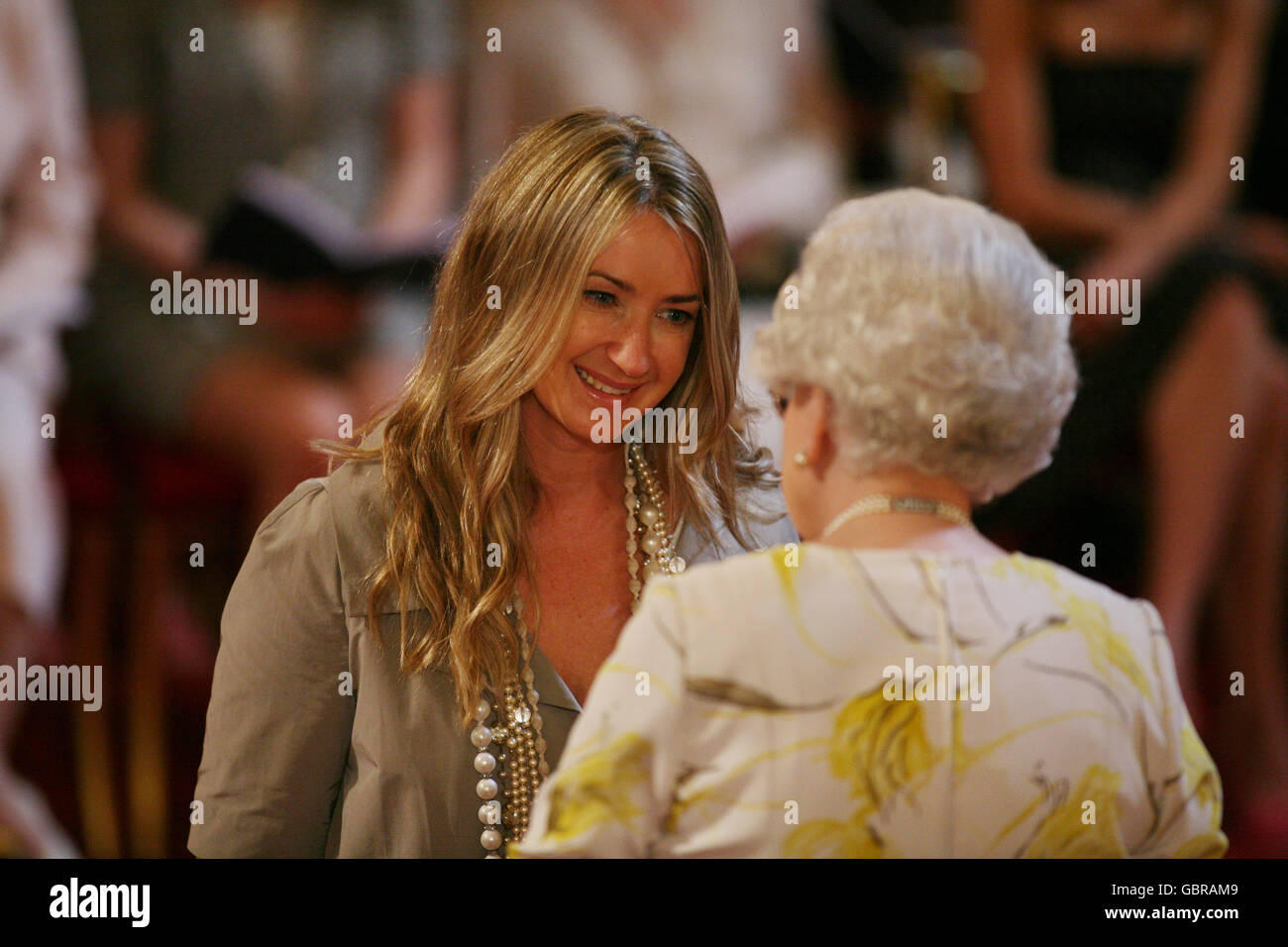 Designer Anya Hindmarch receives an MBE from Queen Elizabeth II during ...