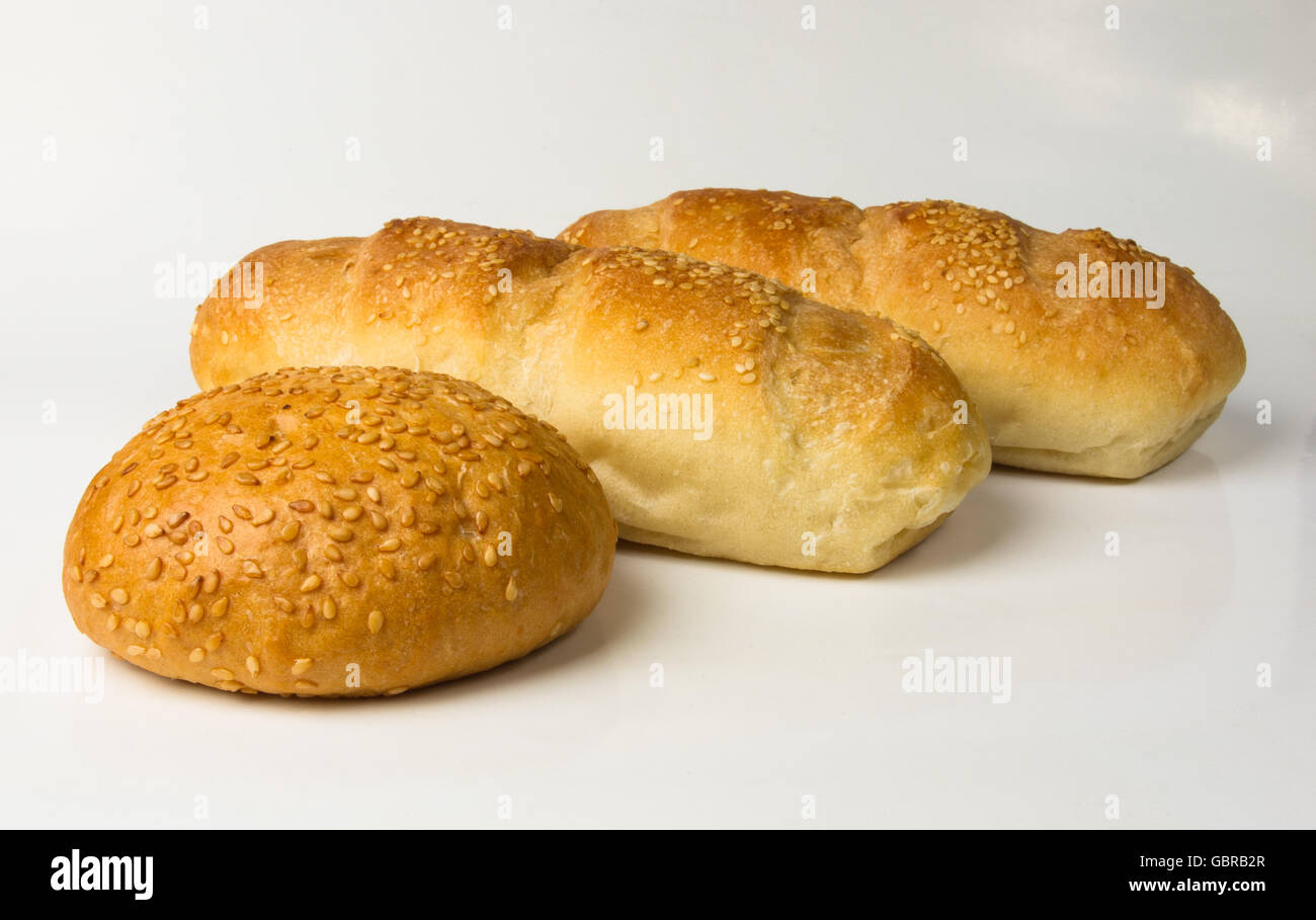 whole wheat two breads and bun on white background Stock Photo - Alamy