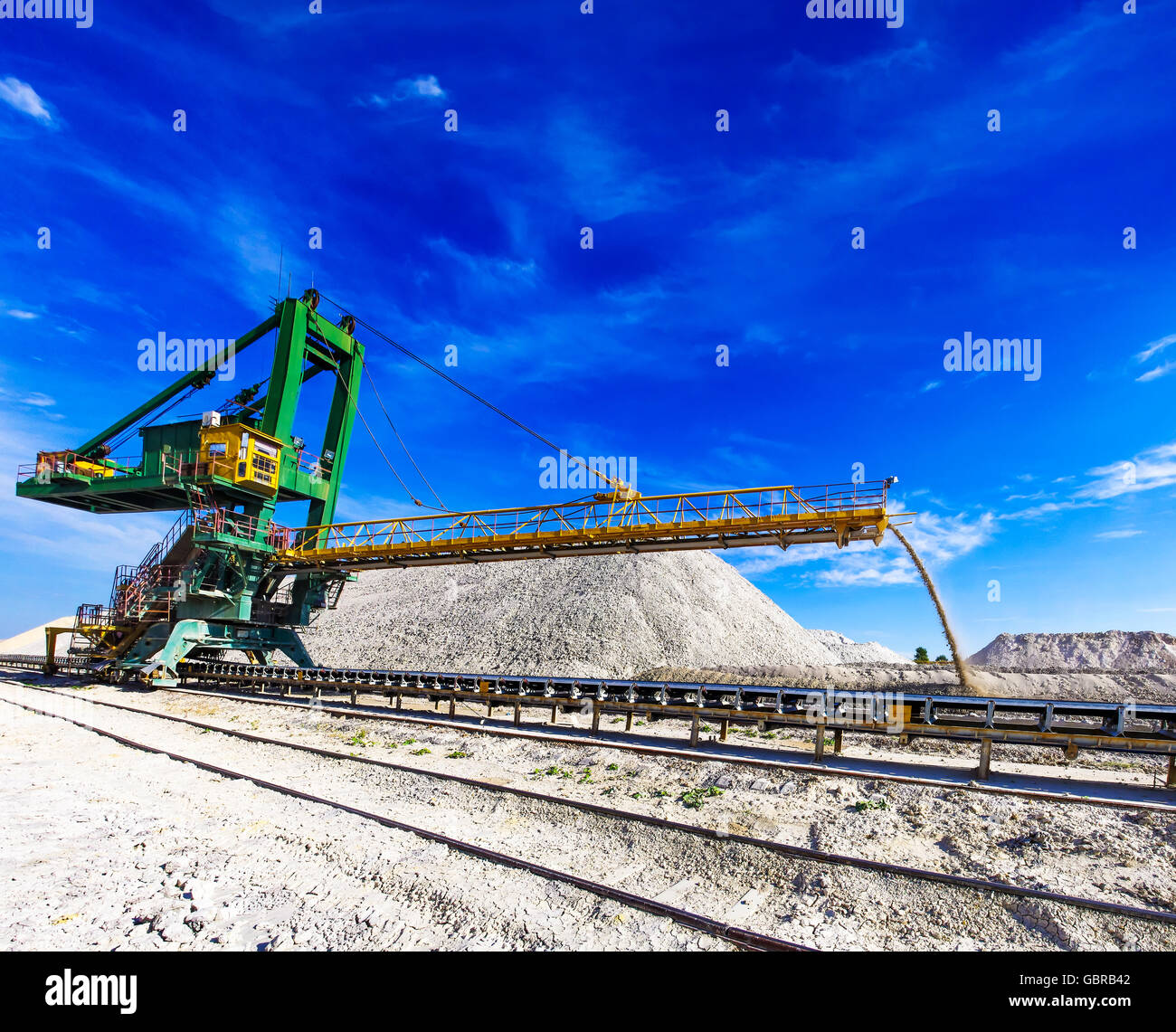 running a huge mechanism for storing clay in his career, summer day ...