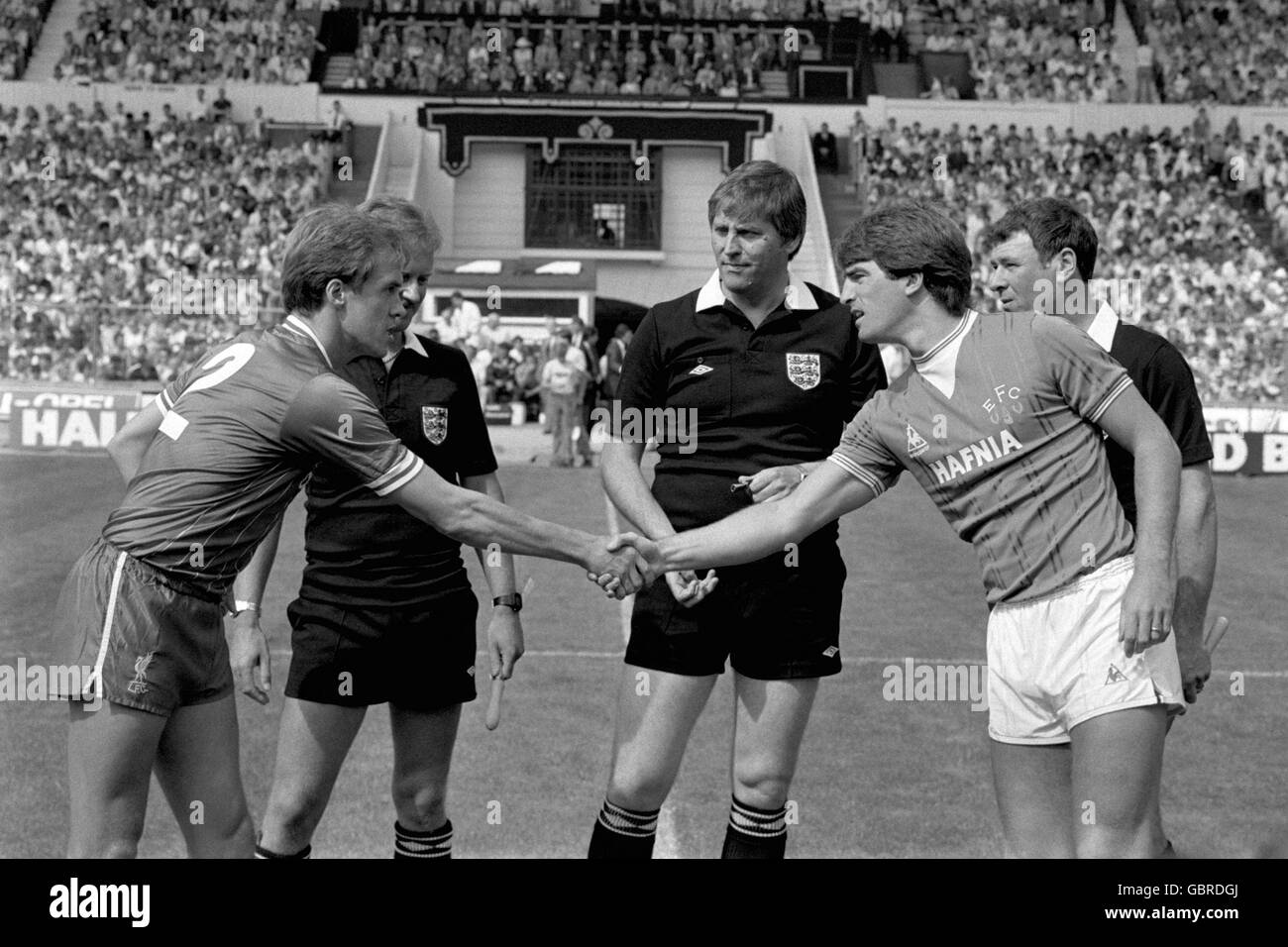 Referee Keith Hackett (c) looks on as the two captains, Liverpool's ...