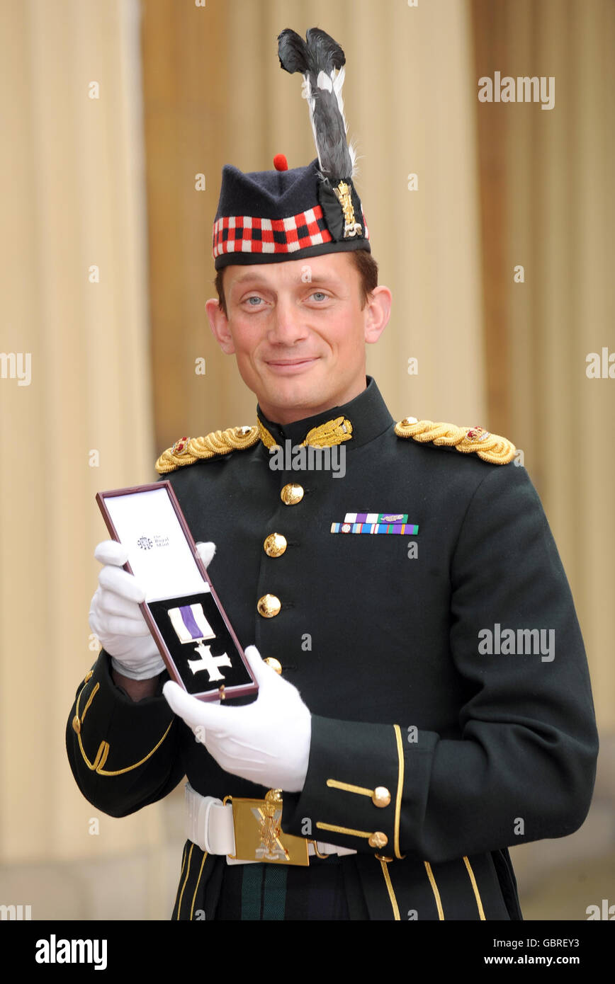 Major Nicholas Calder outside Buckingham Palace after being awarded the Military Cross by the ...