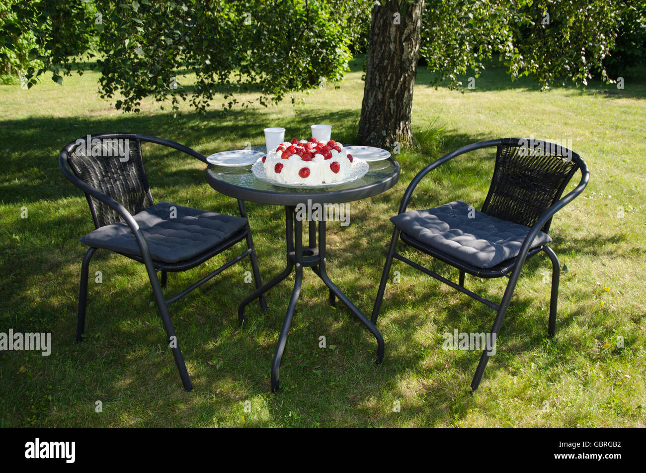 Two red garden chairs hi-res stock photography and images - Alamy