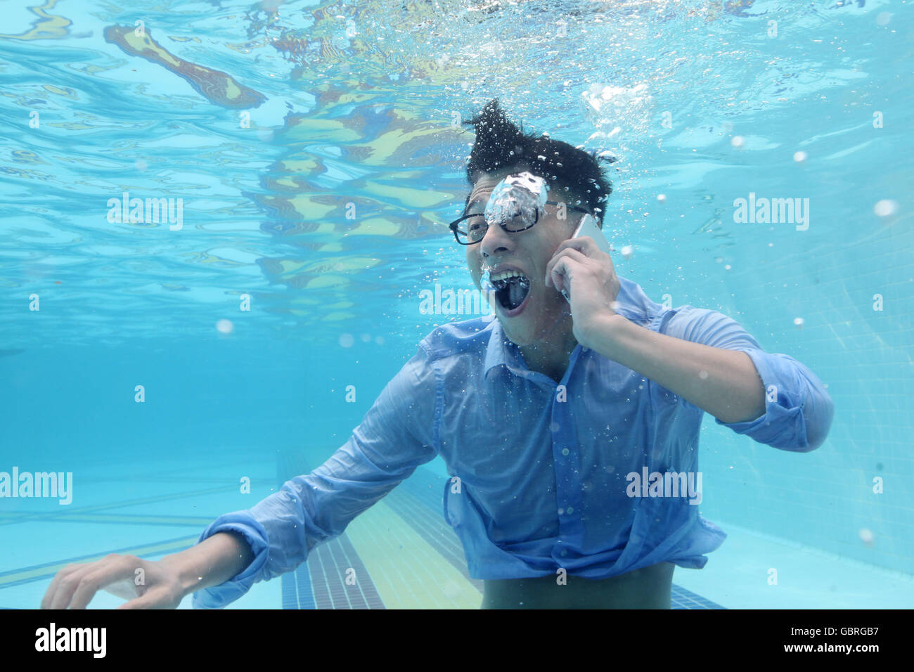Business men call under the water Stock Photo - Alamy
