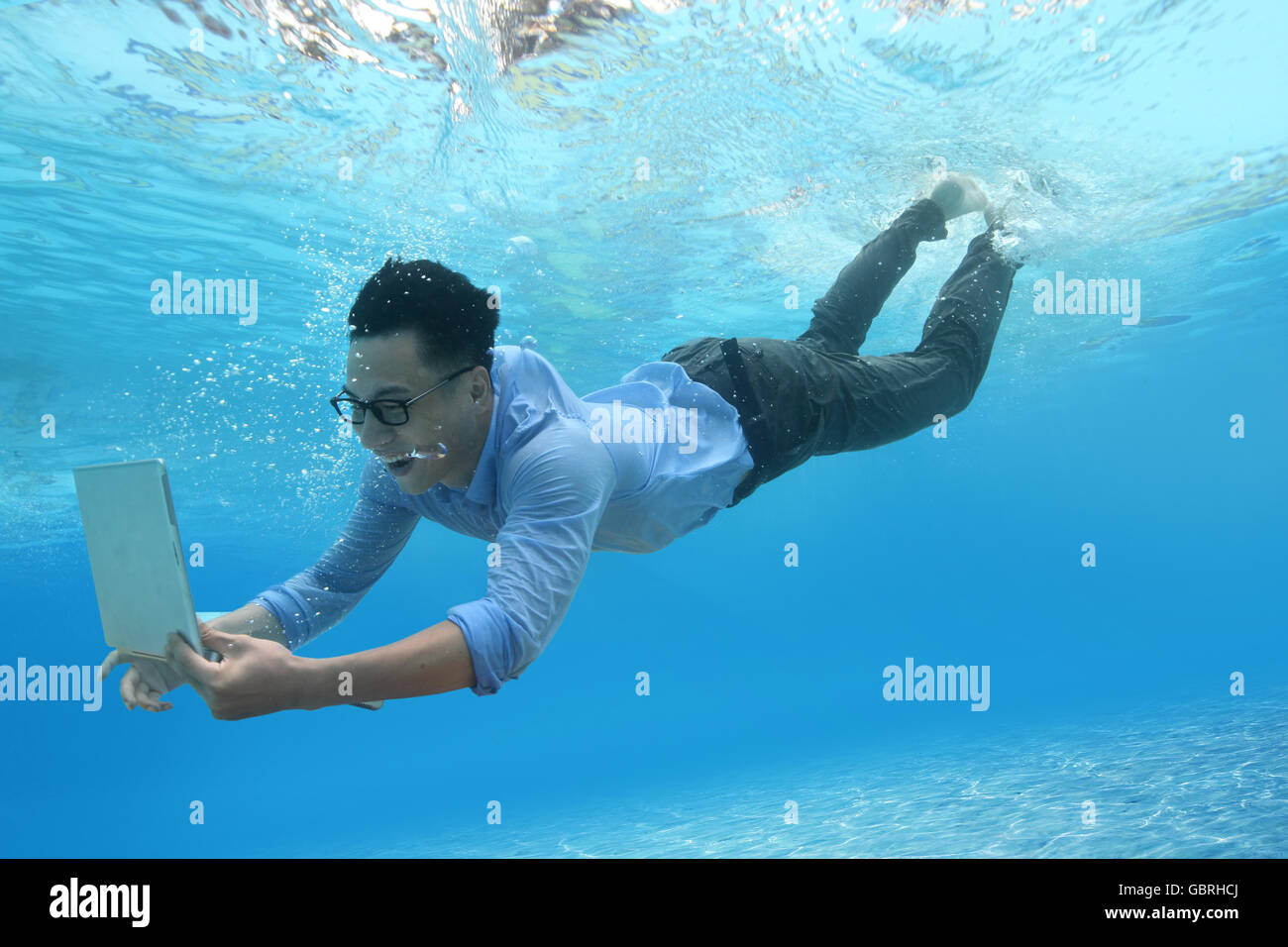 Business men use computers under water Stock Photo - Alamy