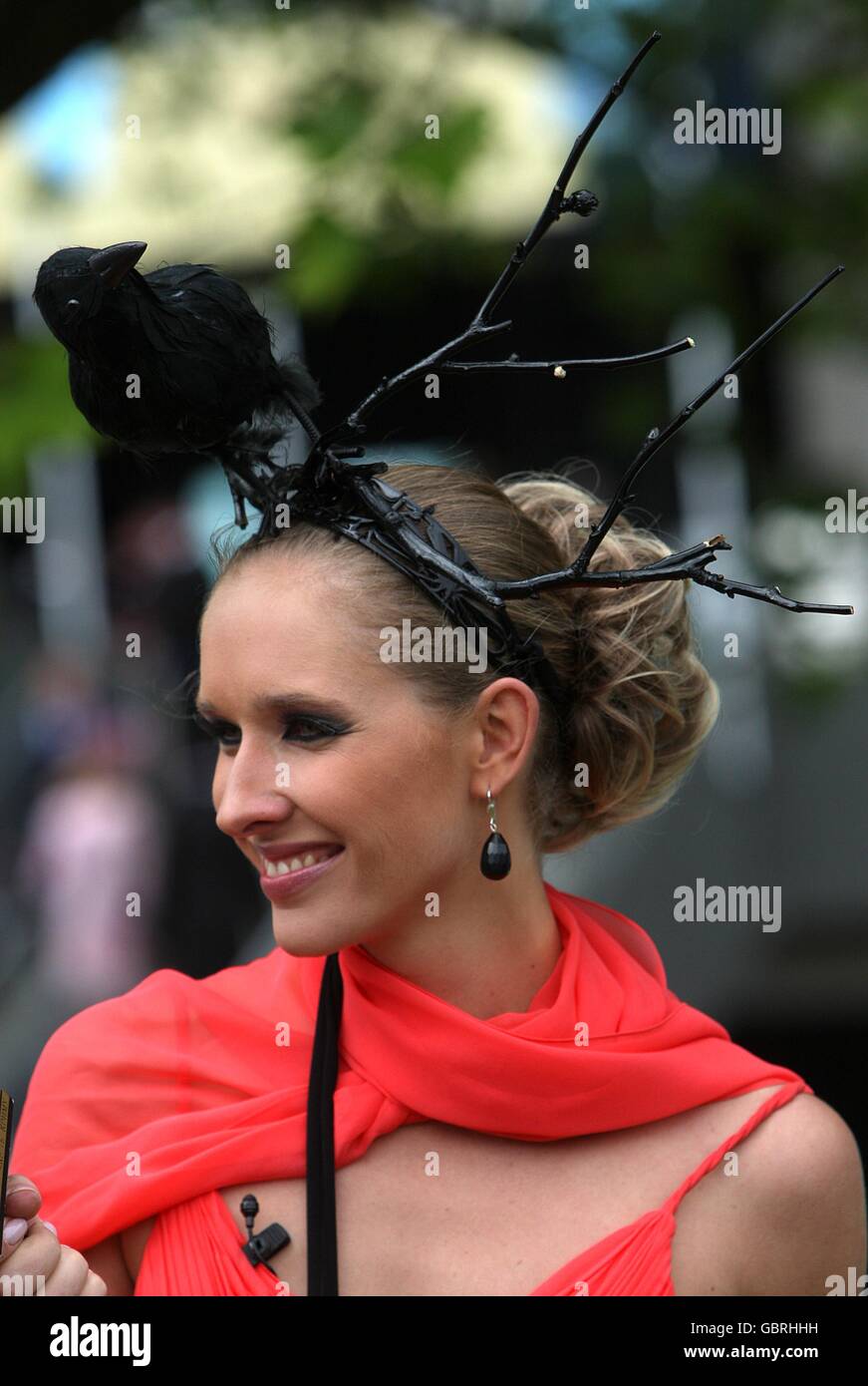 A bird forms part of a hat worn by a lady at Ascot Racecourse ...
