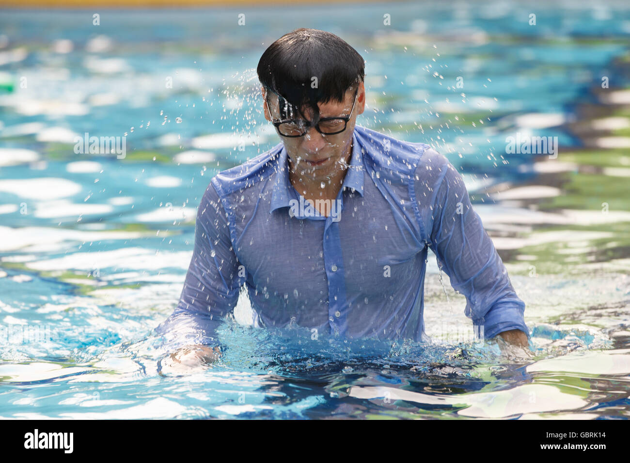 Business man wading Stock Photo - Alamy