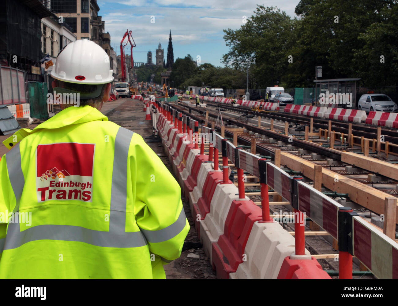 Photo. Tram workers get ready to cement in the new tram line into place ...