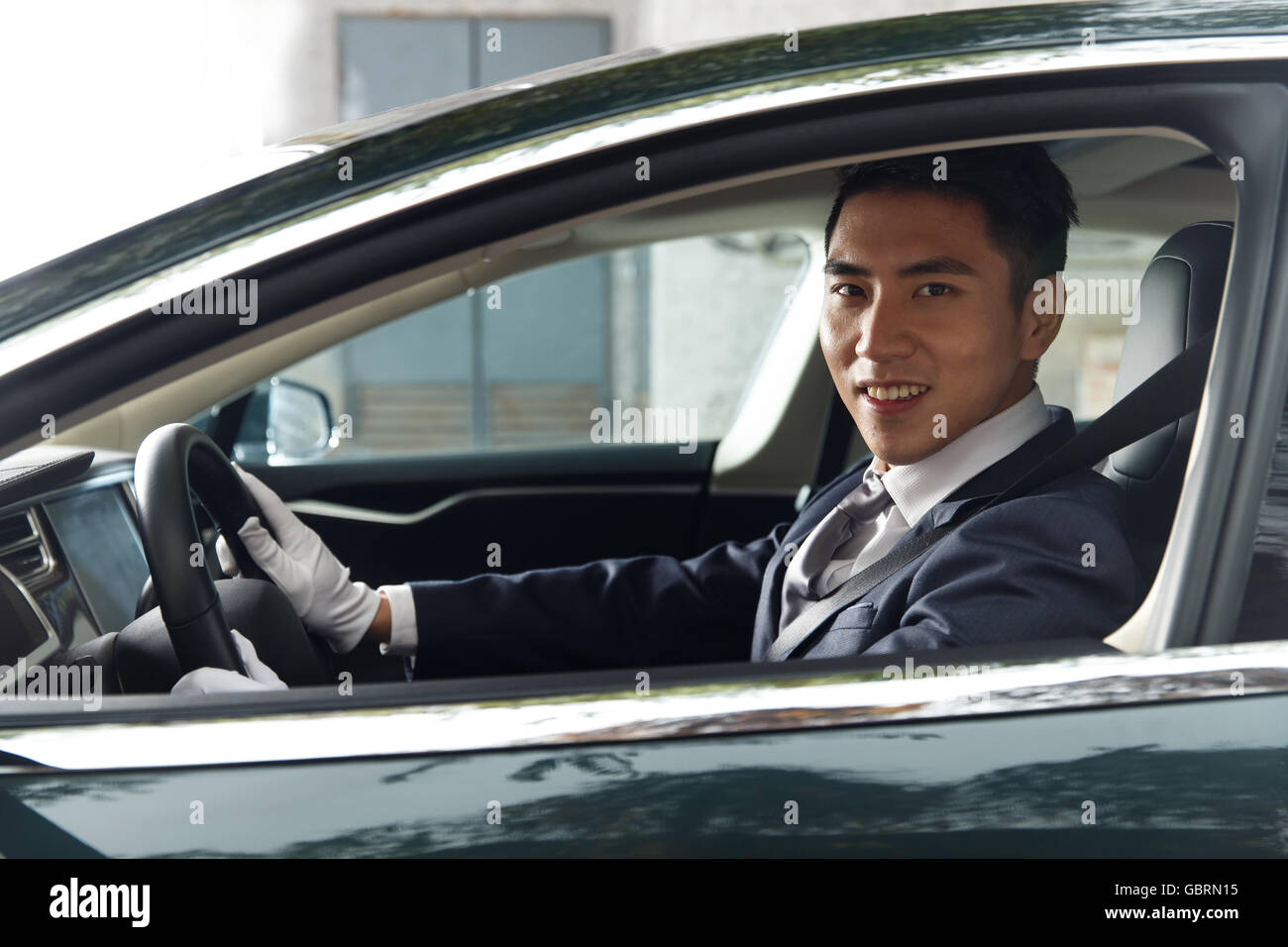The young man is driving Stock Photo - Alamy