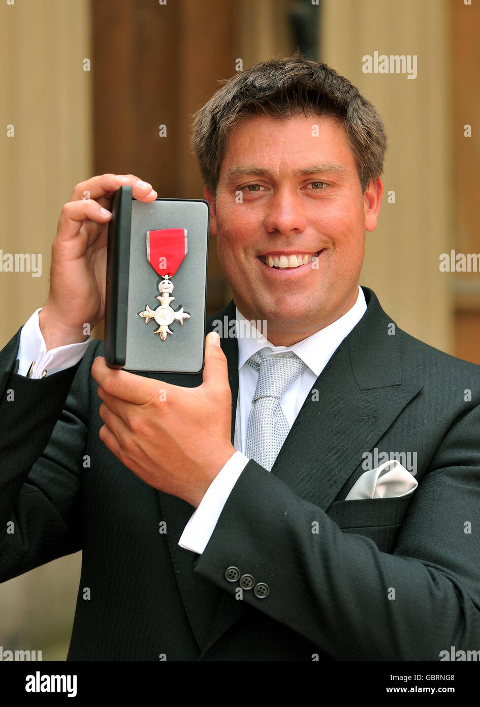 Olympic Gold medallist sailor Andrew Simpson with his MBE after it was ...