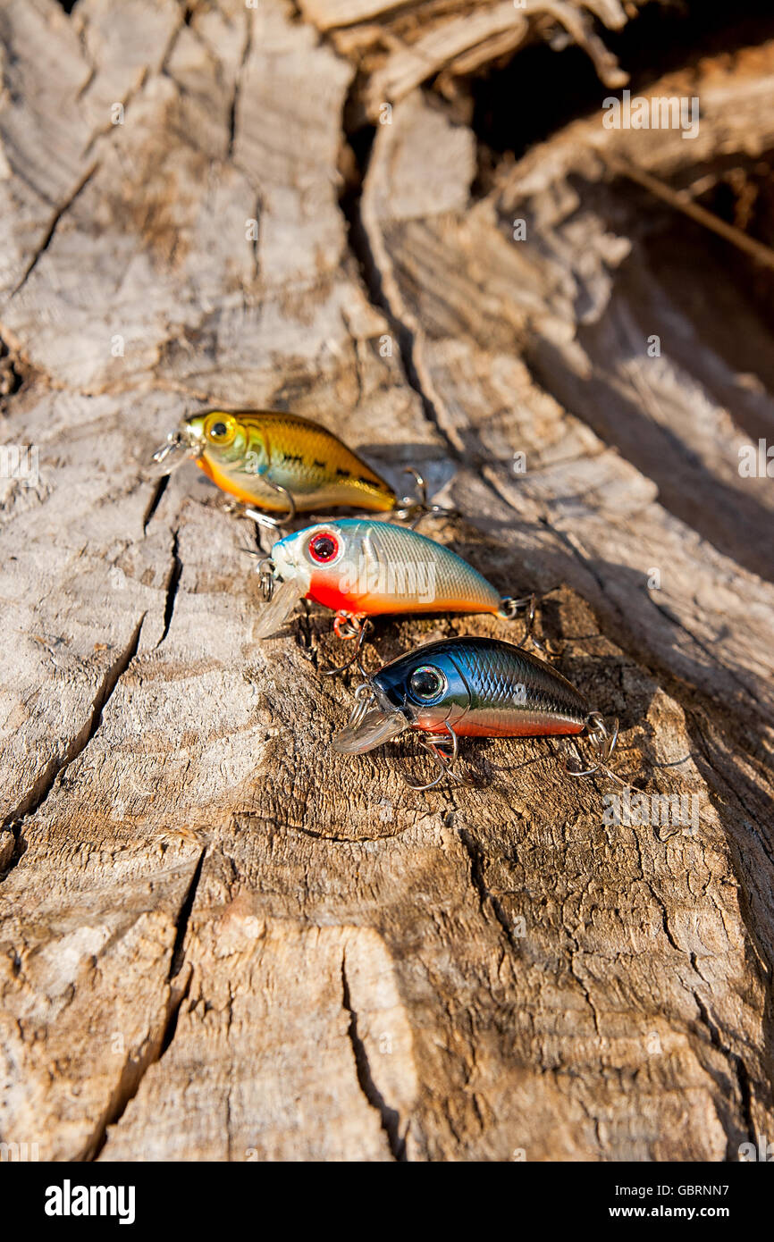 Assorted of various kind of fishing baits on the natural background ...