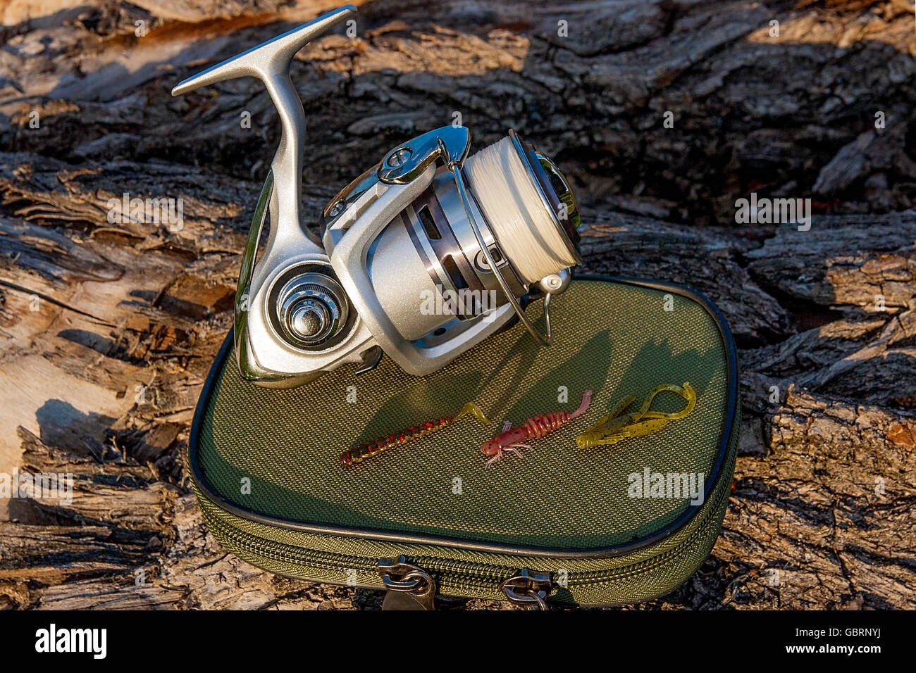 Fishing rod with fishing reel on the natural background. Assorted of ...