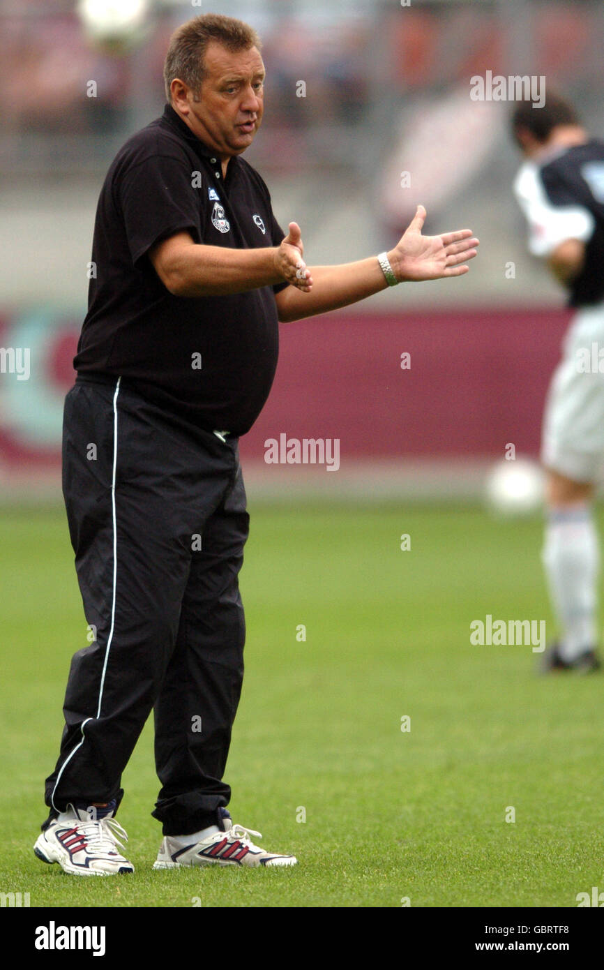 Aberdeen manager Jimmy Calderwood relays instructions to his team ...