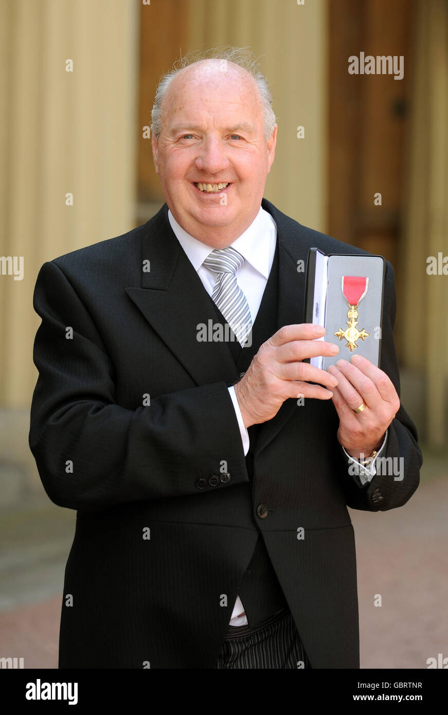 Brian McCargo outside Buckingham Palace after being awarded an OBE by ...