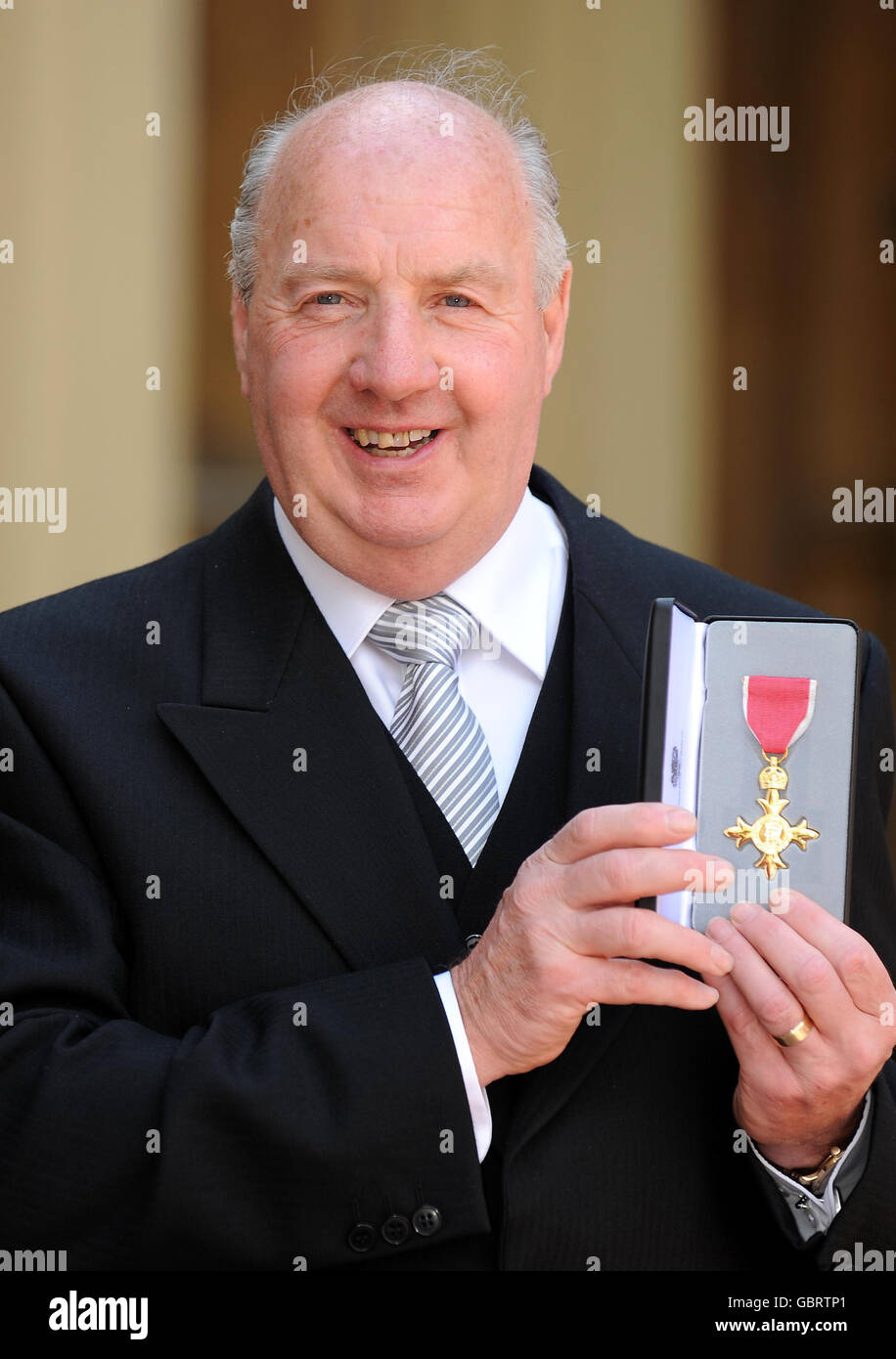 Brian McCargo outside Buckingham Palace after being awarded an OBE by ...