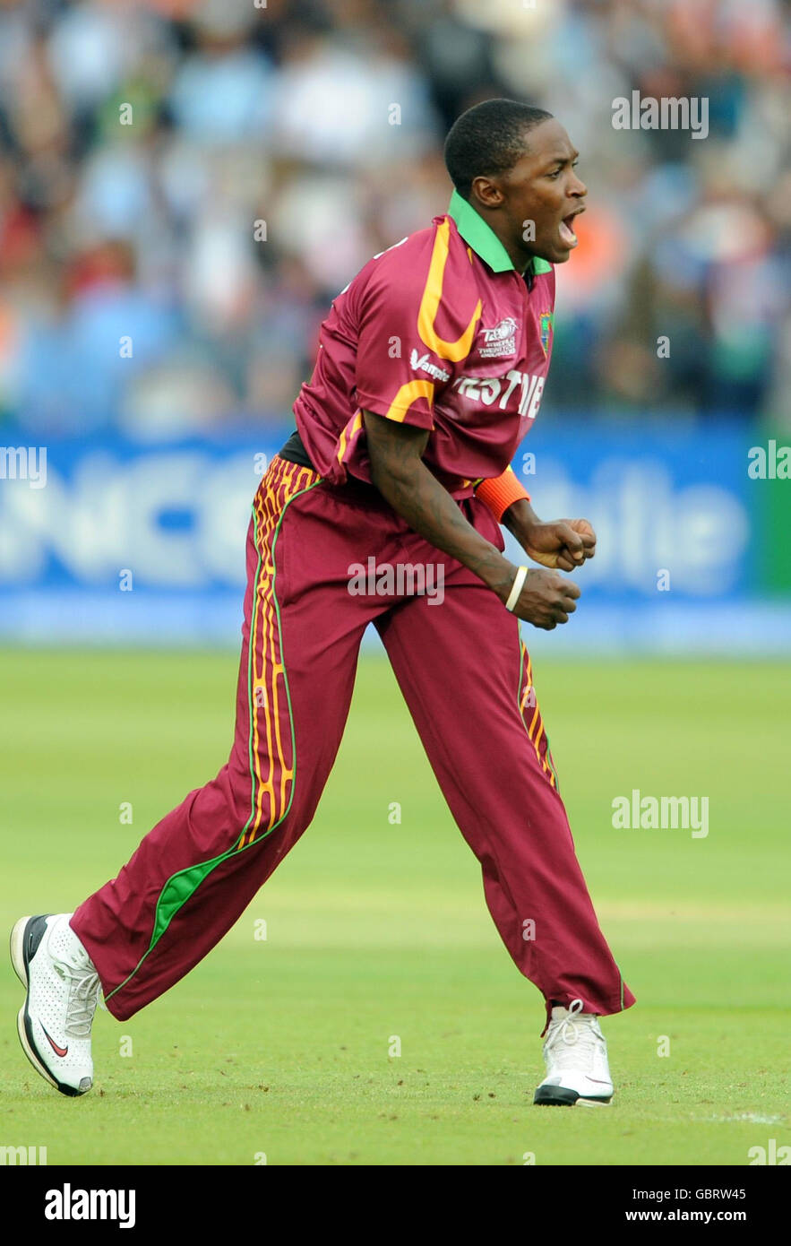 West Indies bowler Fidel Edwards celebrates taking the wicket of India ...